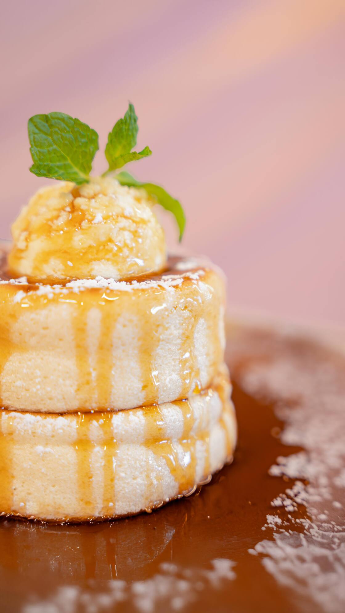 Fluffy Japanese soufflé pancakes topped with vanilla ice cream, maple ...